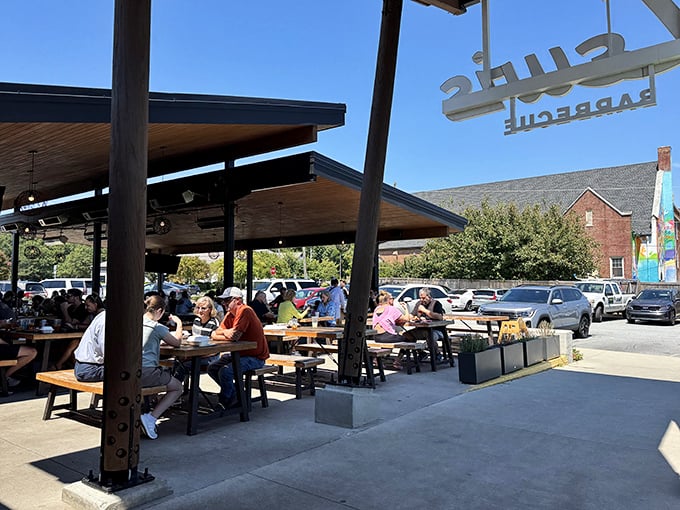 When the outdoor seating looks this inviting, you know the pitmaster takes both atmosphere and flavor seriously.