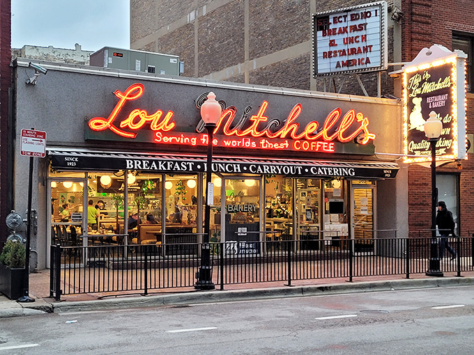 When the sun goes down, Lou Mitchell's neon glow promises that breakfast magic is still happening inside. A beacon of hope for early risers and night owls alike.