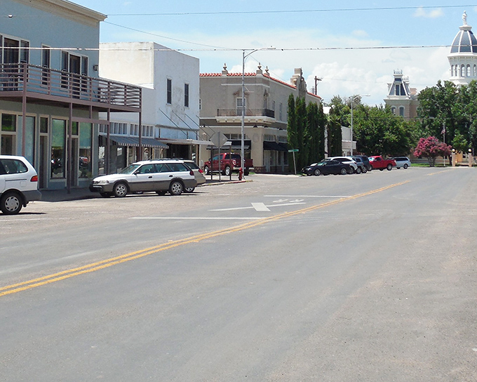 Desert town architecture stands proud under endless blue skies in remote West Texas beauty.