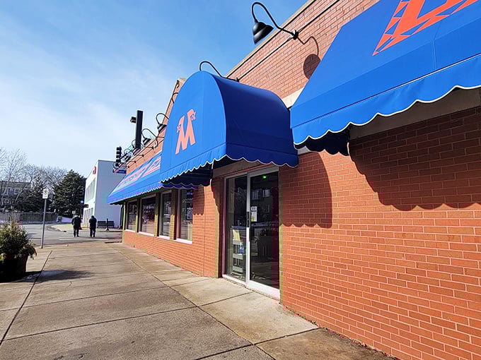 That iconic blue canopy isn't just eye-catching&mdash;it's a beacon guiding hungry pizza pilgrims to their destination.