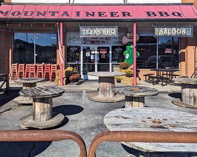 Texas BBQ meets Mountain State hospitality at Mountaineer’s storefront, where a red awning and rustic hay bales create that perfect “come as you are” vibe.