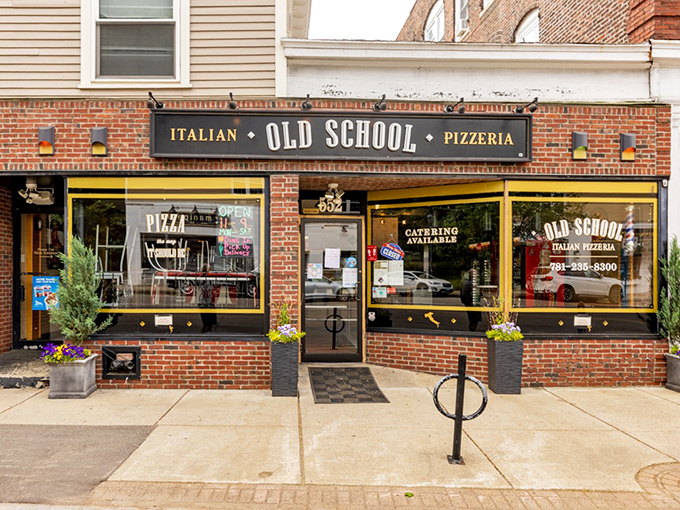 Yellow trim and classic signage announce what your nose already knows: authentic Italian pizza lives here.