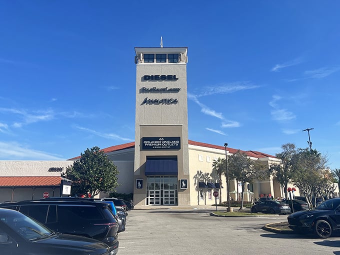 Retail therapy under Florida's blue skies. This towering entrance to Orlando Vineland Premium Outlets stands like a gateway to discount heaven.