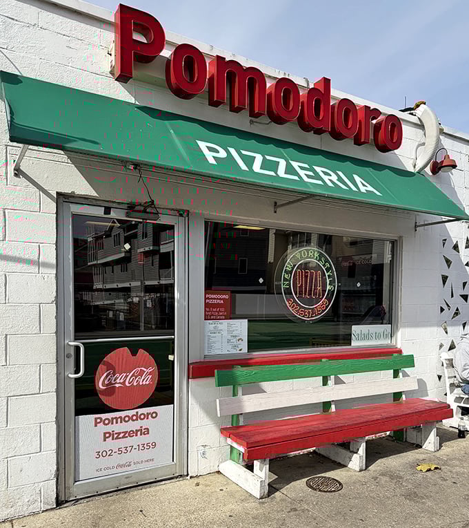 That green awning signals serious Italian pizza ahead &ndash; the kind that makes you forget your beach diet immediately.
