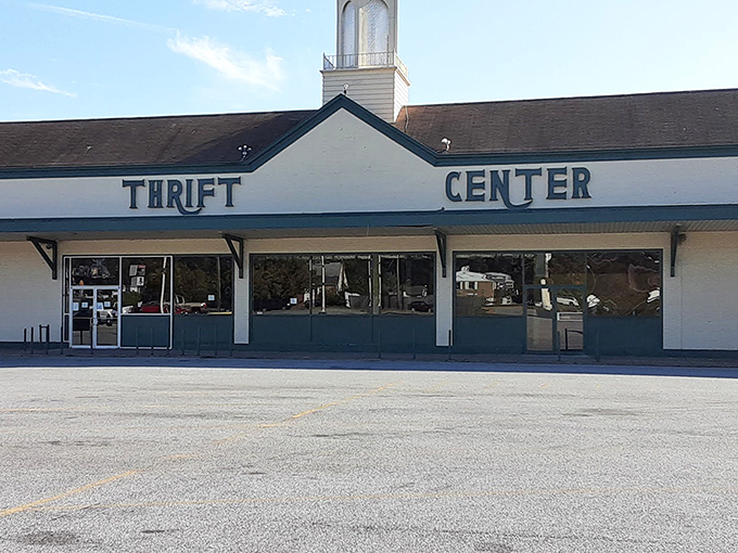 The Thrift Center storefront stretches wide like a treasure chest waiting to spill its bargain-filled secrets inside.