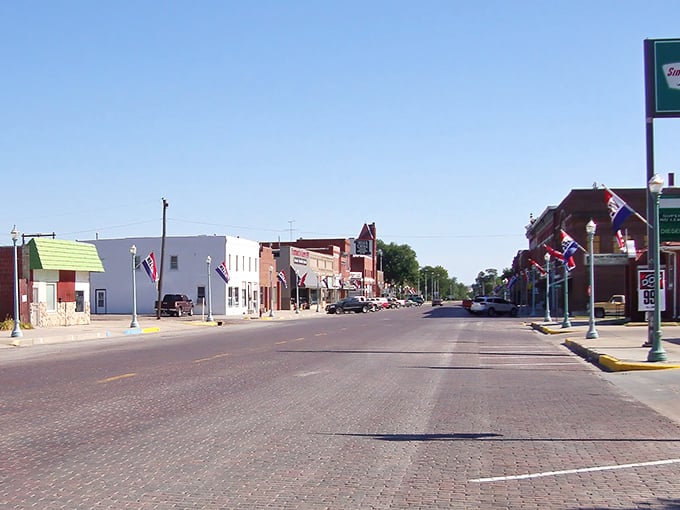 Those flags aren't just for show&mdash;they're waving hello to visitors discovering Red Cloud's brick-lined charm.