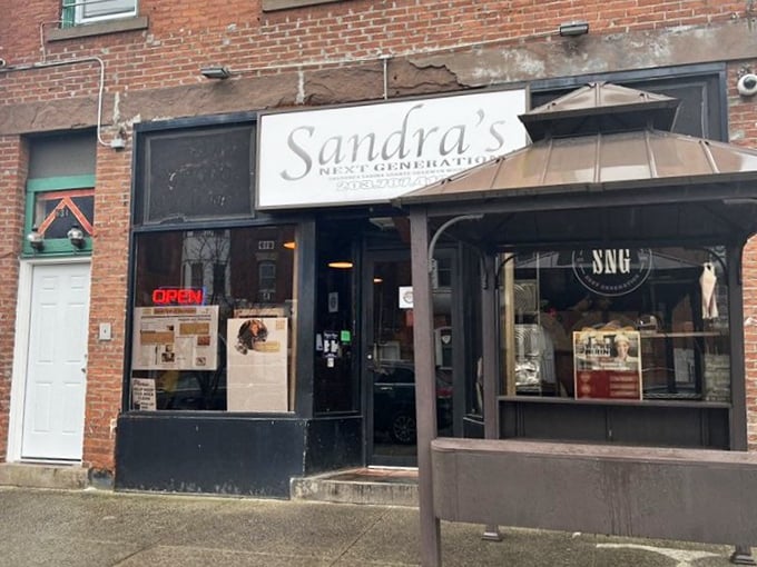 Brick walls and modest signage hide Sandra's culinary magic &ndash; like finding a secret passage to fried chicken paradise.