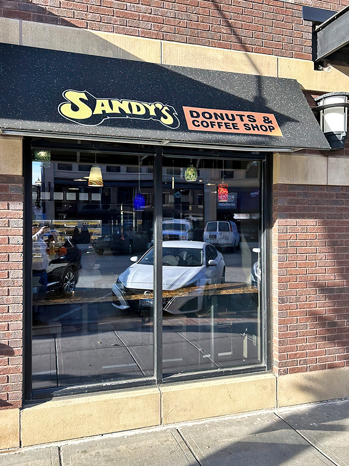 Sandy's iconic sign promises donut paradise &ndash; and trust me, they deliver on that promise every single day.