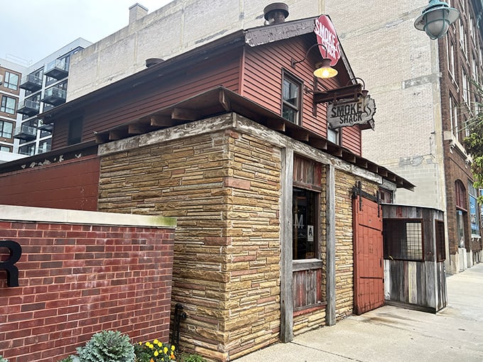Like finding a rustic smokehouse dropped into downtown Milwaukee, this charming spot promises authentic flavors behind that weathered facade.