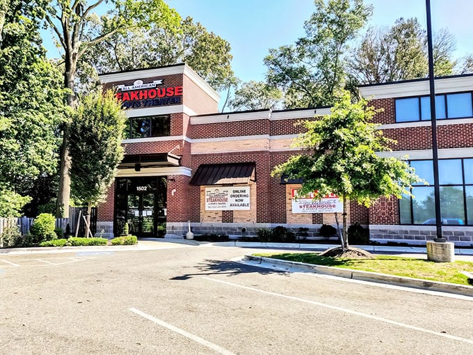 Sunshine bathes this suburban steakhouse in golden light. The All American's unassuming exterior hides a carnivore's paradise waiting to be discovered.