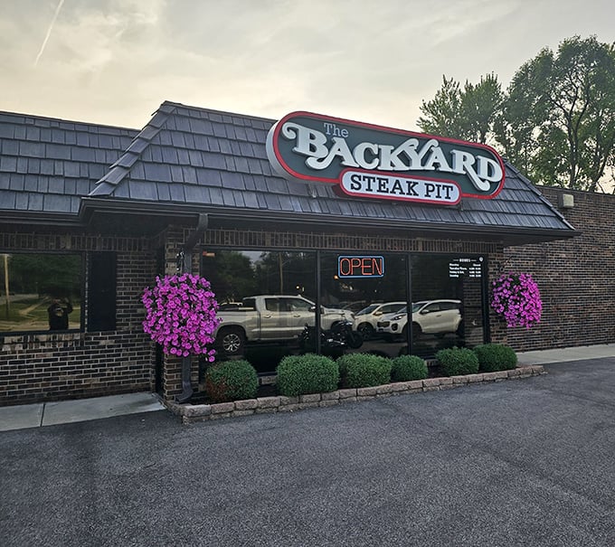 Flower baskets frame this unassuming steakhouse gem. The kind of place where the parking lot fills up before the sun goes down.