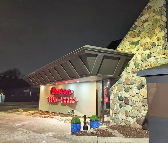Night falls, but The Clawson Steakhouse glows like a beacon for the steak-obsessed. That stone facade has stories to tell!
