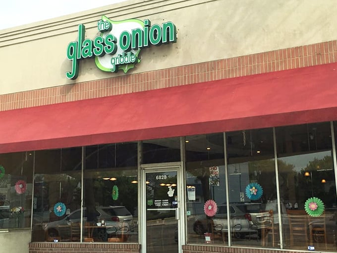 Colorful paper decorations dance in the windows, hinting at the cheerful vibe waiting inside this unassuming strip mall treasure.