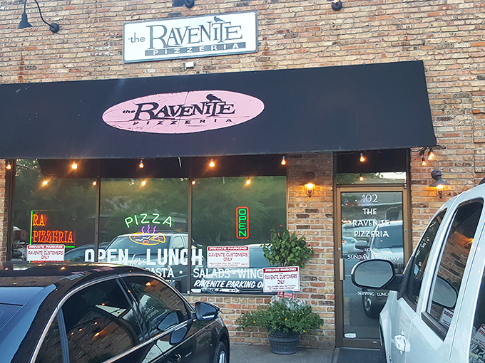 That classic black awning and vintage signage? Dead giveaway you're about to experience pizza that'll haunt your dreams.