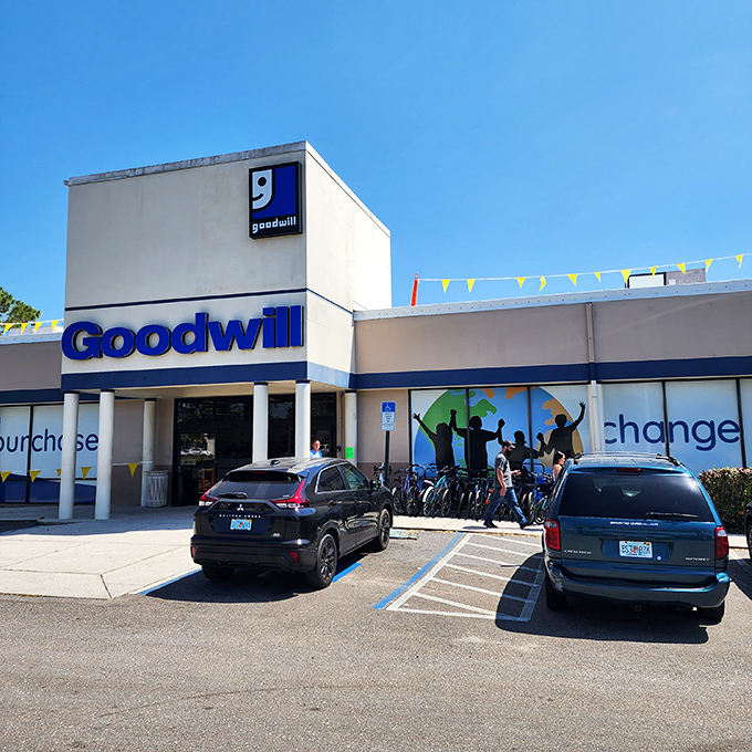 Colorful flags flutter above the entrance, promising a carnival of secondhand treasures inside.