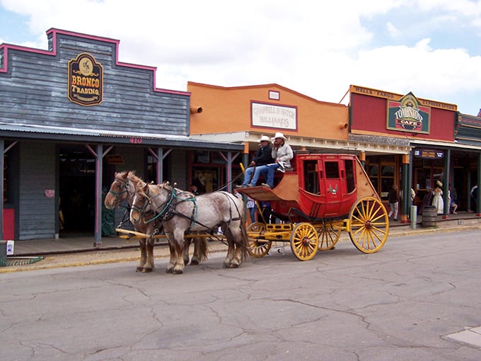 Horse-drawn stagecoach rolling through Tombstone &ndash; the Uber of the 1880s, but with more character!