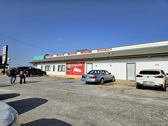 The classic roadside appeal of West Side Cafe beckons hungry travelers. Those red accents practically scream "good food ahead!"