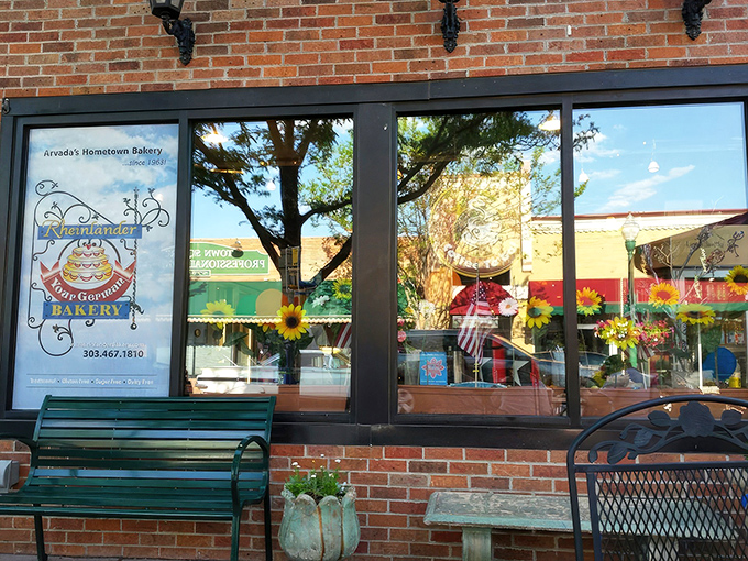 The bakery's welcoming facade stands as a beacon of buttery hope in Olde Town Arvada's historic brick landscape.
