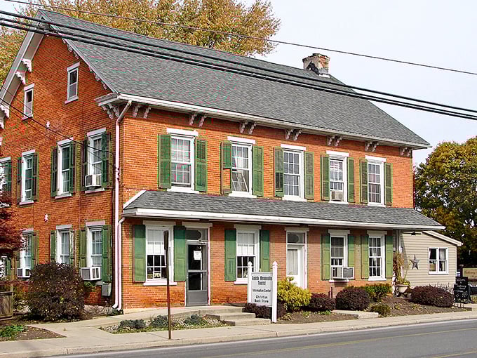 This charming brick building with distinctive green shutters houses local treasures. Its well-preserved facade speaks to the town's commitment to maintaining its historical character.