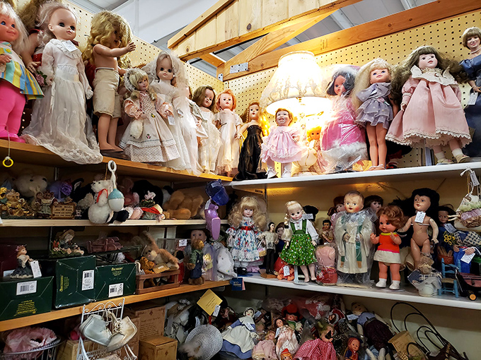 An army of vintage dolls stands at attention, their porcelain faces telling silent stories of tea parties and childhood dreams from decades past.