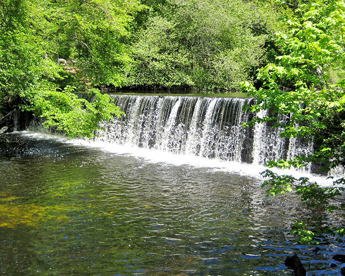 Arnold Mills Falls creates nature's soundtrack&mdash;a gentle cascade that invites contemplation and the occasional brave toe-dipping adventure.