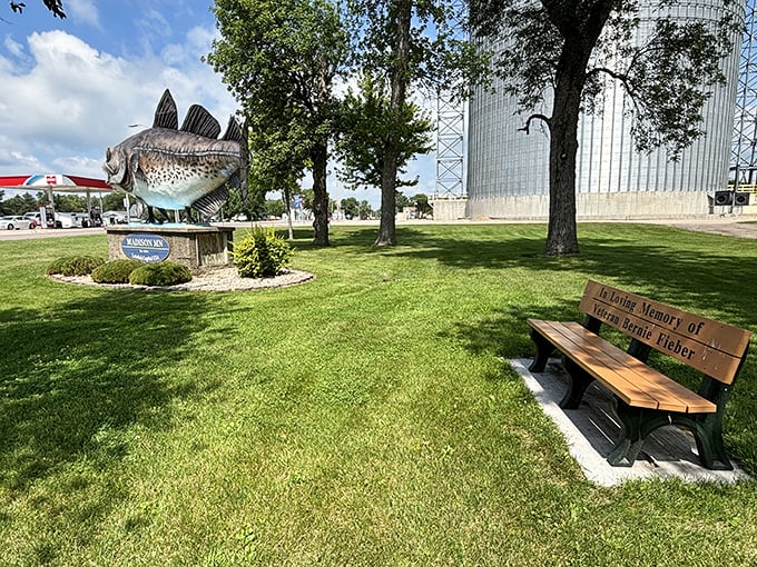 A peaceful bench invites visitors to sit and contemplate the fishy wonder, perhaps while enjoying a non-lutefisk picnic lunch.