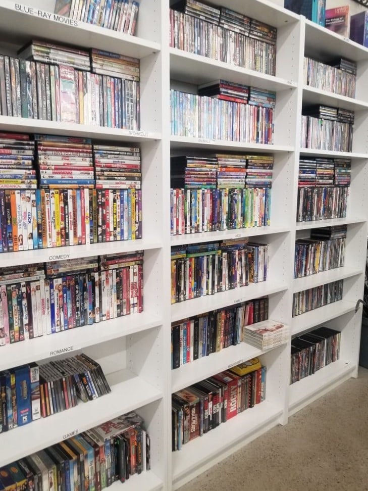 Movie buffs rejoice at the meticulously organized media section, where yesterday's blockbusters await their second chance to entertain at fraction-of-theater prices.