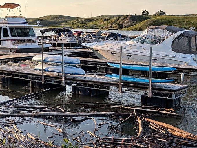 Boats rest peacefully at the marina as rolling prairie hills stand guard. Weekend captains and serious anglers alike find their happy place here.