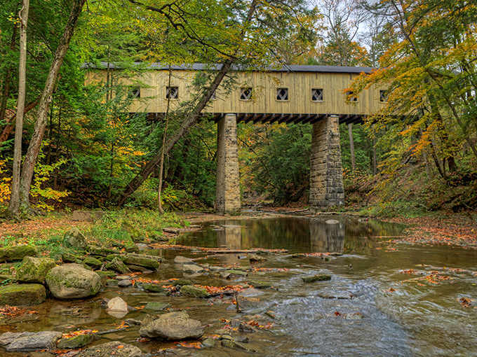Few things beat the view from underneath: stone pillars holding history while Phelps Creek whispers its timeless tune.