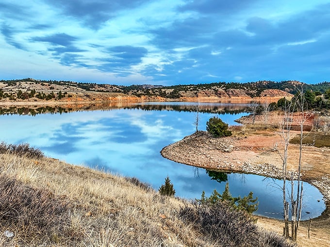 That magical moment when the sky and water conspire to create the perfect blue sandwich, with golden hills as the delicious filling.