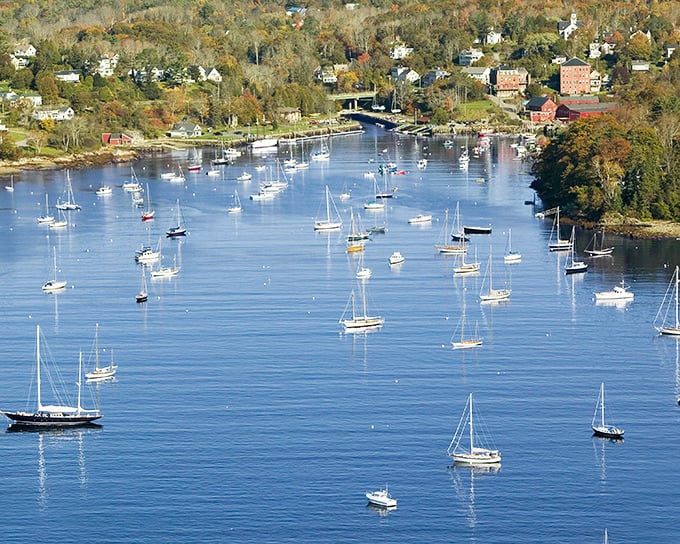 The harbor view that launched a thousand postcards. Camden's sailboats rest on water so blue it looks Photoshopped, but I assure you&mdash;it's real Maine magic.