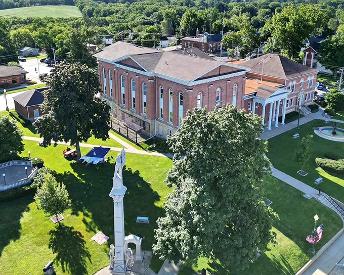 The Carroll County Courthouse stands proudly amid manicured lawns, a testament to small-town civic pride and 19th-century architectural ambition.