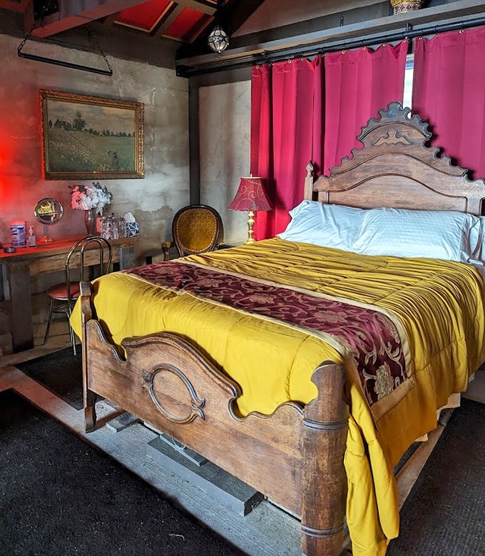 Medieval meets modern comfort in this royal chamber. The ornate wooden bed frame and rich gold bedspread would make King Arthur himself put away his sword for a proper nap. 