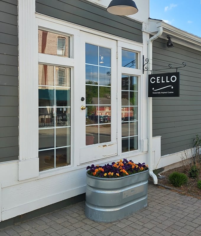 Cello's unassuming entrance belies the culinary symphony within. Those vibrant pansies aren't just decoration&mdash;they're a colorful preview of the seasonal inspiration that awaits inside.