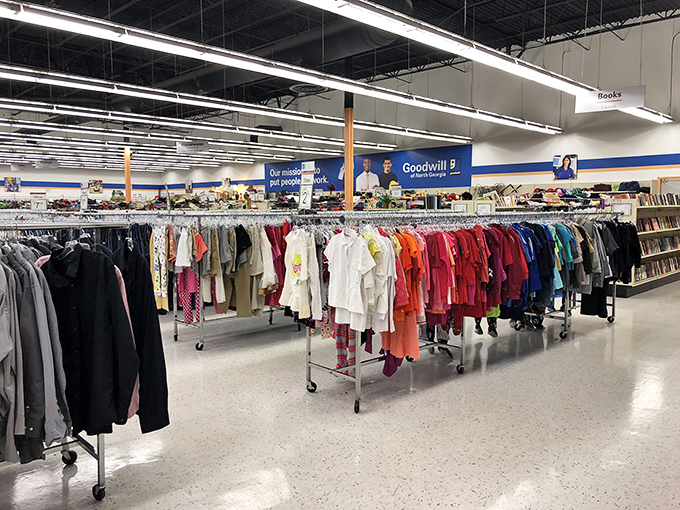 Color-coded clothing racks create a rainbow road through the store, where yesterday's fashion finds new life and new closets.