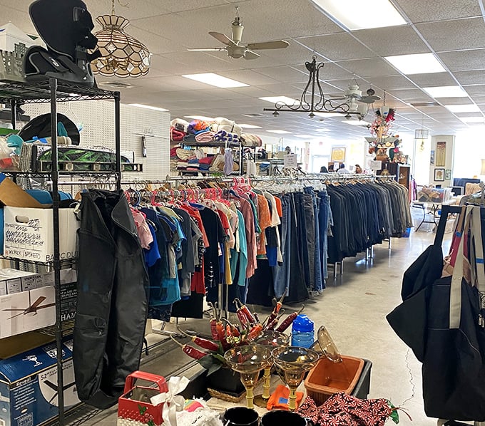 Clothing racks stretch toward the horizon like a textile rainbow. That perfect vintage jacket is hiding here somewhere, patiently waiting for you.