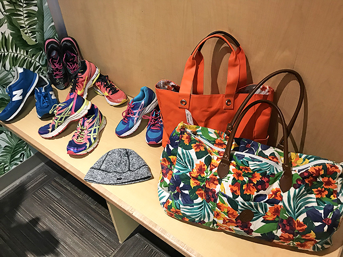 Fashion meets function in this colorful lineup. These gently-used athletic shoes and vibrant bags are waiting for their second act in someone's active lifestyle.