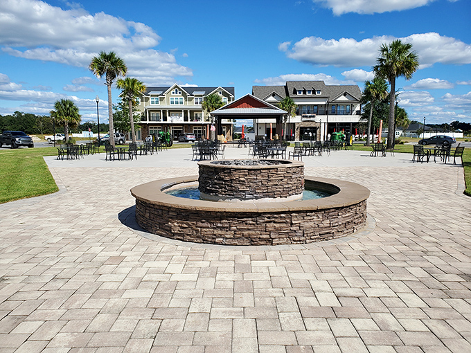 At Countryway Town Square, the stone fountain isn't just decorative&mdash;it's where retirement dreams crystallize while palm trees sway overhead like nature's approval.