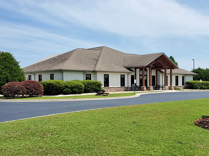 This welcoming community building houses stories waiting to be discovered, its manicured grounds inviting visitors to pause and appreciate simpler pleasures.