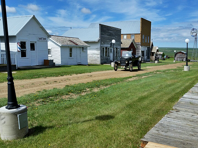 Pioneer Town's historic buildings stand as time capsules of prairie life, complete with an antique vehicle that probably gets better cell reception than you will.