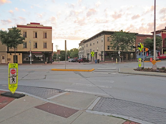 Downtown Winooski at dusk, where the rotary isn't just a traffic pattern but practically a town mascot. 