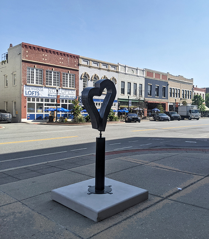 That modern heart sculpture stands like Cupid's abstract cousin, reminding passersby that love comes in all artistic forms.