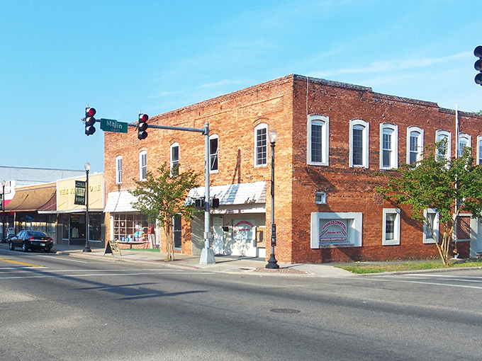 Main Street and Jefferson intersect at this classic brick corner building, where time moves at the pace of friendly conversations rather than frantic stock market tickers.