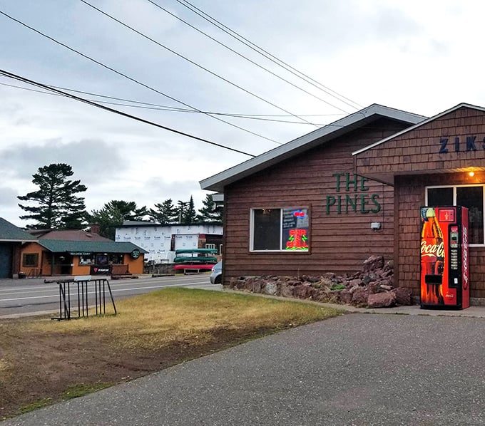 The Pines isn't just a restaurant—it's a time capsule of northwoods charm where that vintage Coca-Cola machine has probably witnessed decades of hungry hikers' stories.