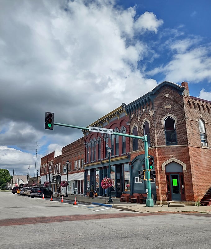 John Wayne Drive cuts through Winterset's brick-lined business district, where the architecture tells stories spanning generations. No CGI needed for this authentic charm.