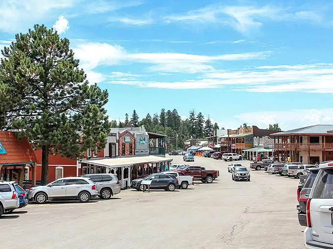 Main Street Cloudcroft, where ponderosa pines stand guard over shops and the sky performs its daily blue masterpiece. Small-town America at its finest.