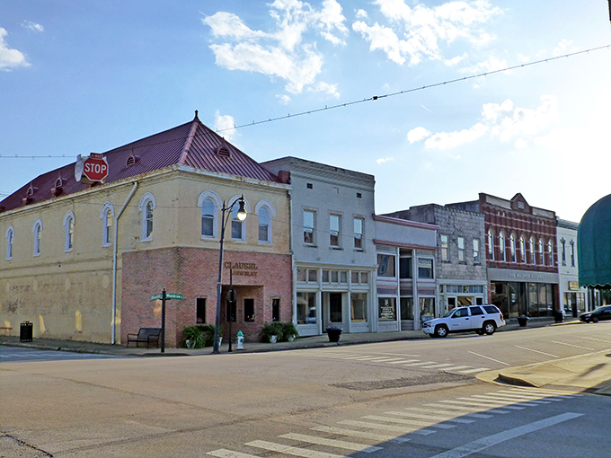 Sunlight bathes Corinth's downtown corner buildings in golden warmth, creating that perfect small-town tableau Norman Rockwell would've painted in a heartbeat.