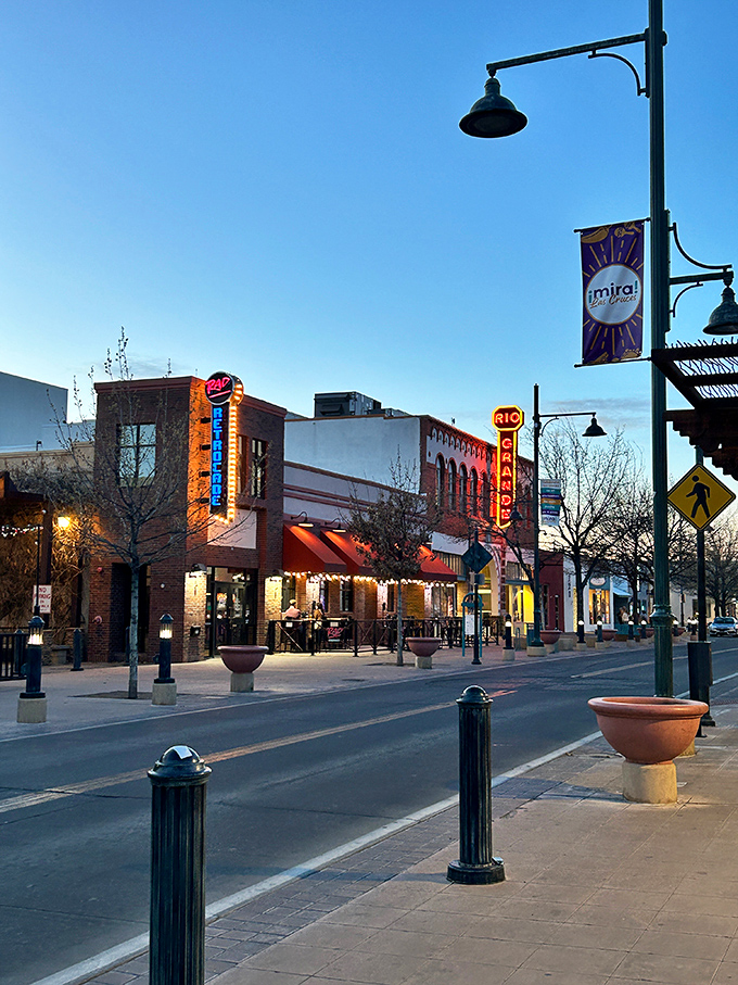 Downtown Las Cruces after sunset—when the neon signs glow and the promise of green chile specialties beckons from historic brick buildings along Main Street.