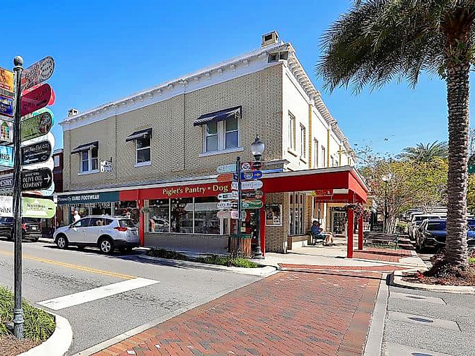 Piglet's Pantry anchors a corner of Mount Dora's brick-paved streets, where colorful directional signs remind you there's no wrong turn in a town this charming.
