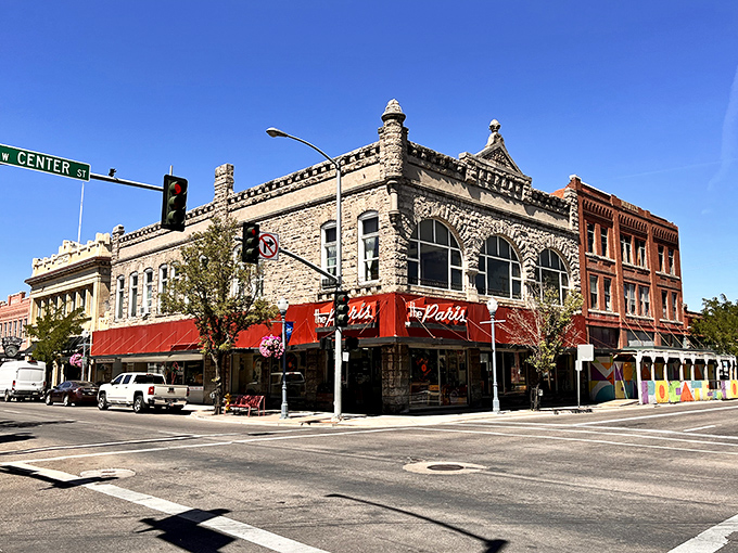 The Palace's distinctive stone facade has witnessed decades of Pocatello life, its red awnings adding a splash of color to this historic corner.